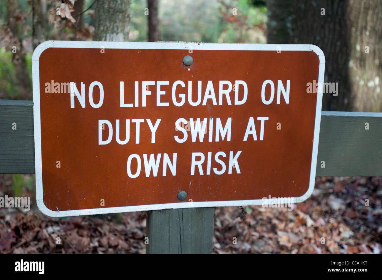 No lifeguard on duty swim at own risk sign Stock Photo - Alamy