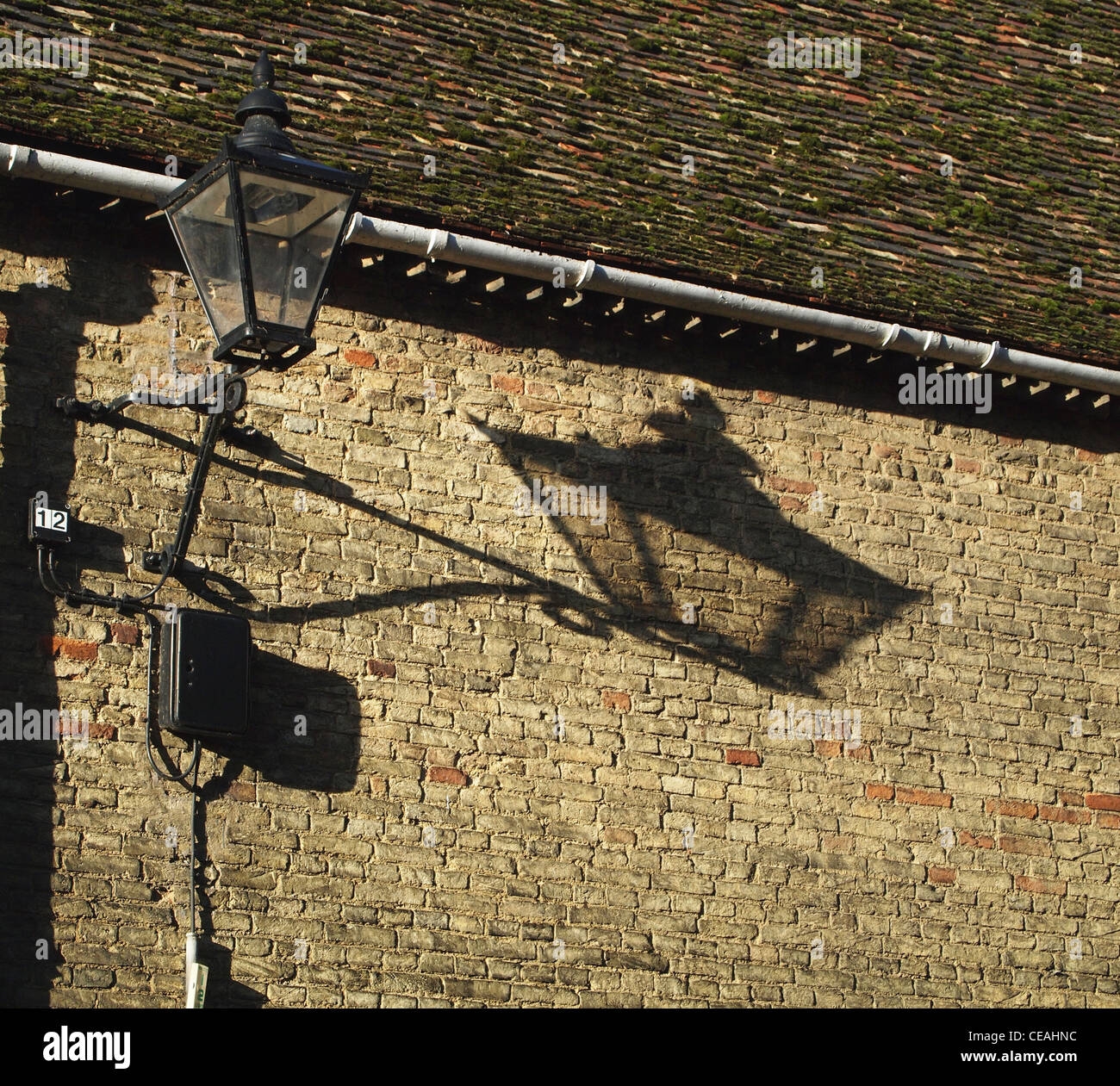 Lamp and shadow on wall Stock Photo - Alamy