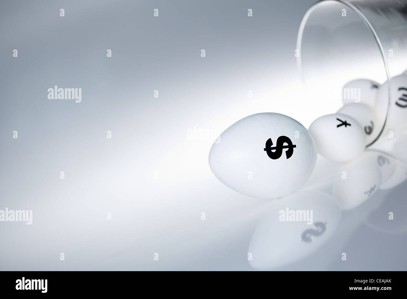 Image of big egg with dollar sign and some smaller eggs on background ...