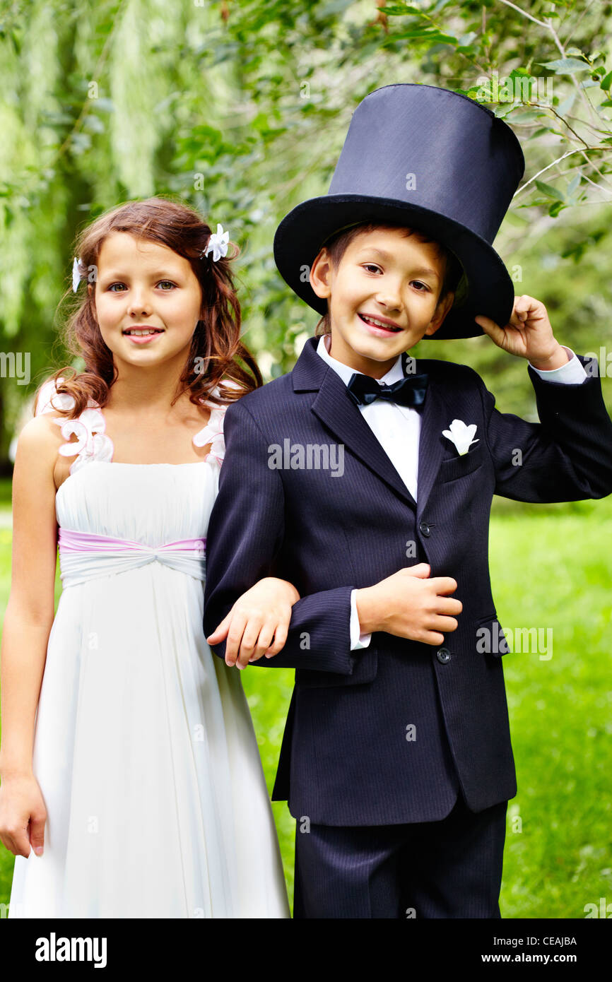 Portrait of happy children bride and groom looking at camera Stock ...