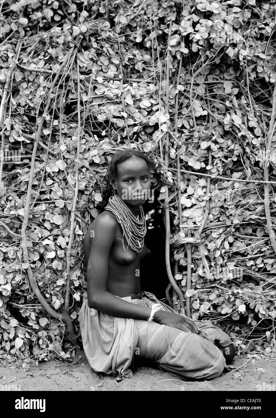 Dassanech Teenage Girl At Entrance Of Natural Materials Hut Omorate ...