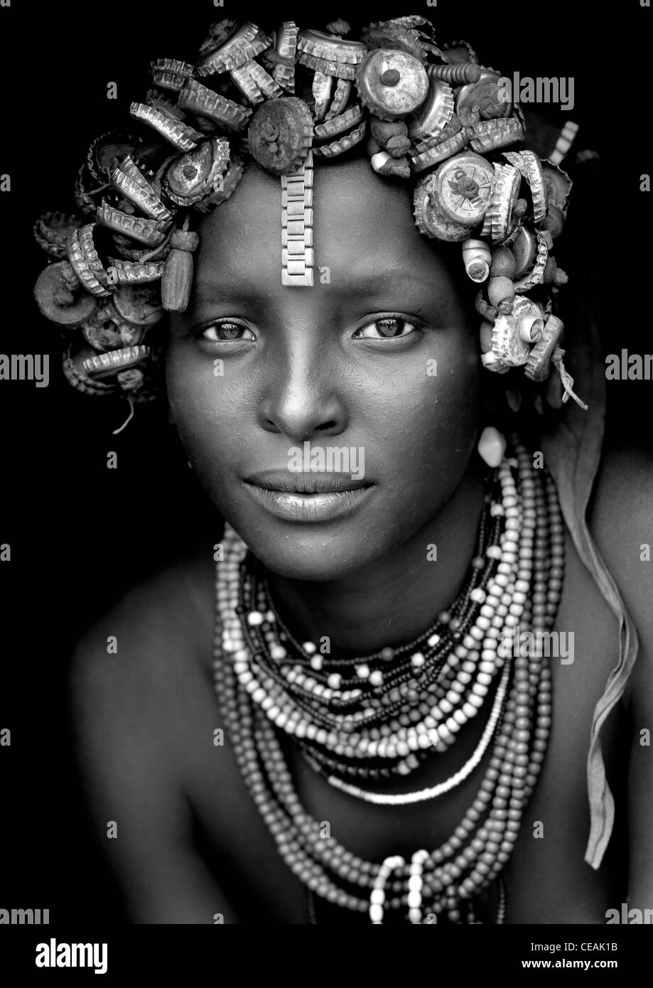 Portrait Of A Young Dassanech Cute Woman Wearing Bottle Caps Headgear ...