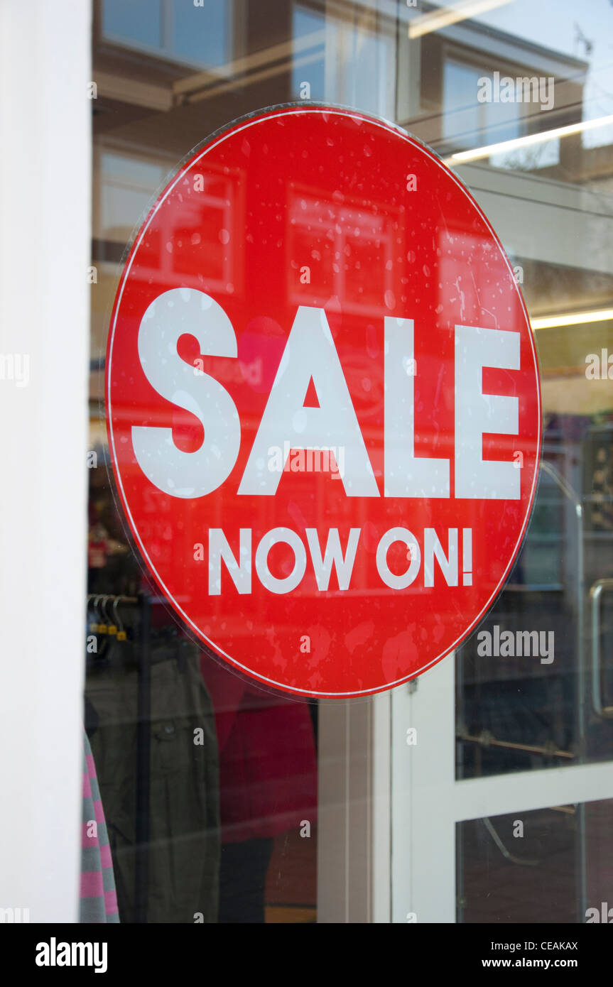 Sale sign in shop window Stock Photo - Alamy