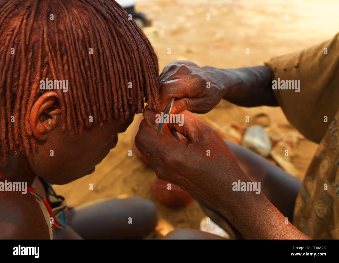 Bana Woman Getting Hair Dressed With Braids And Ochre Dye Omo Valley ...