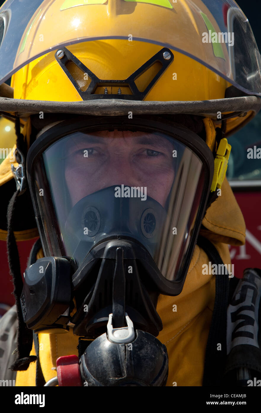 Firefighter on US military in full safety mask and helmet looks to ...