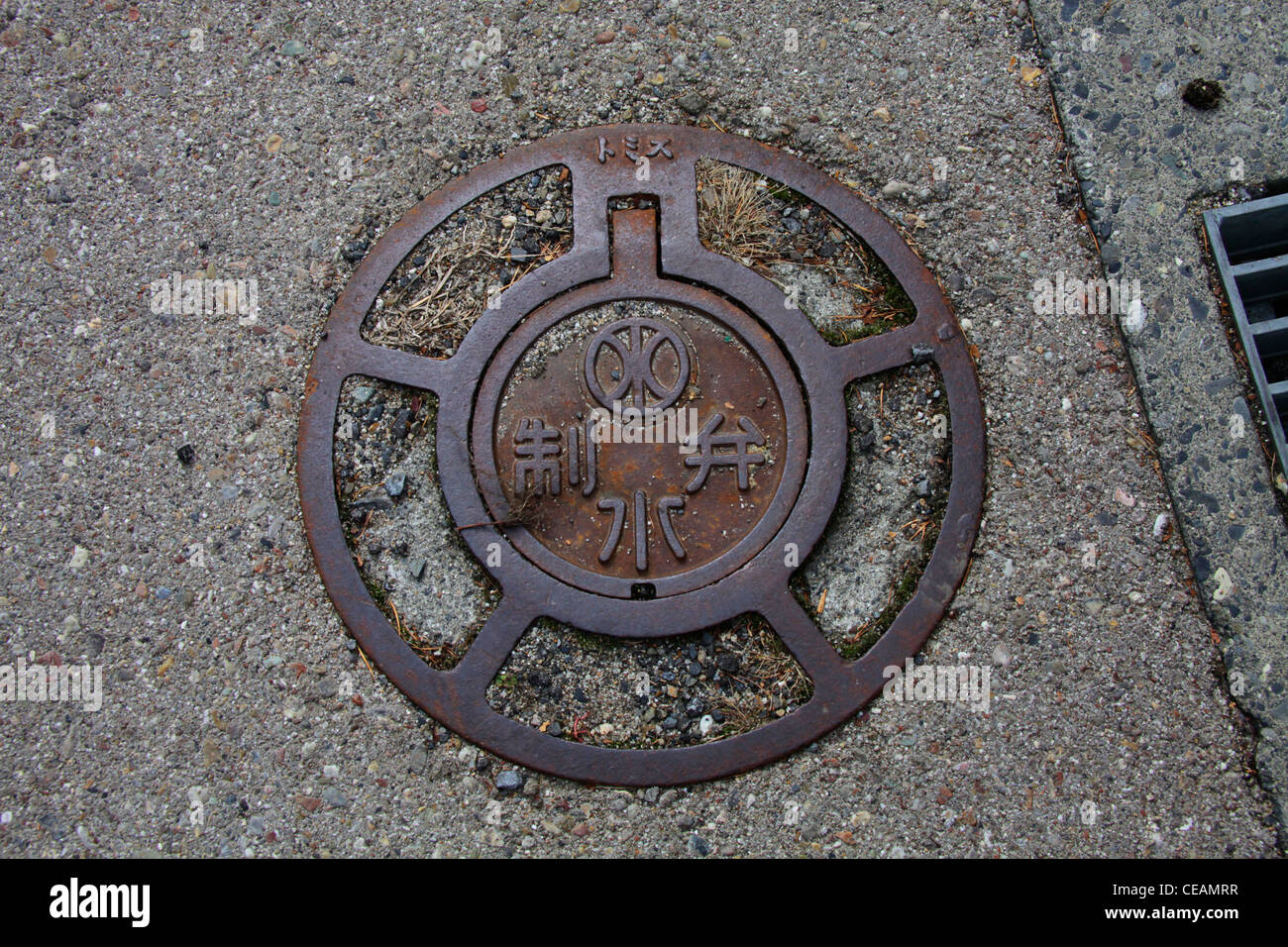 Water valve hatch for fire hydrant on a street Nagano Japan Stock Photo ...