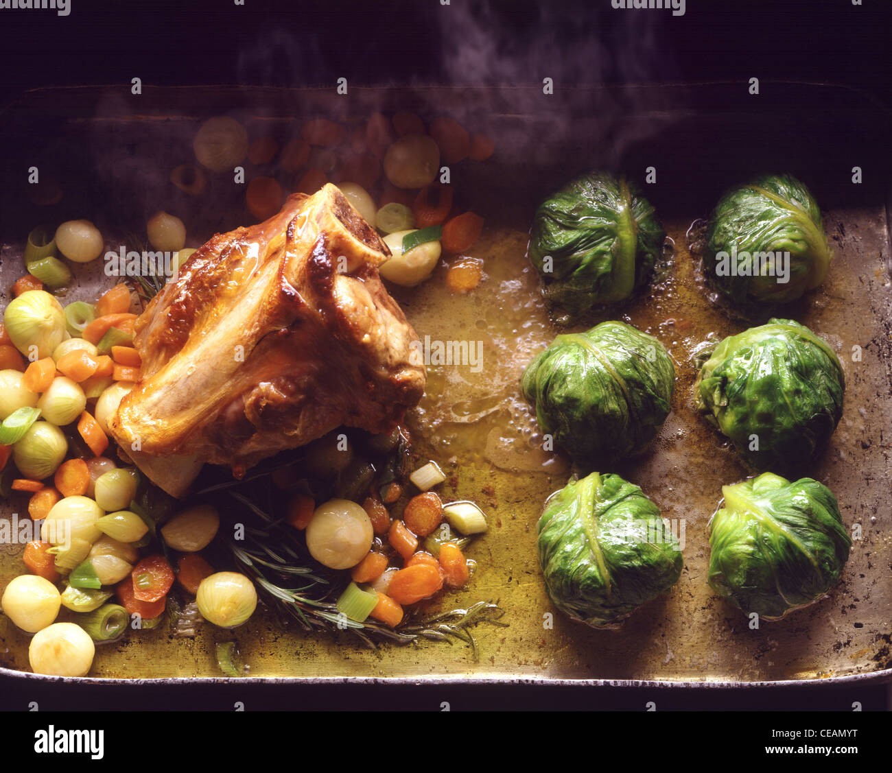 Still: Fried leg of veal with lettuce Stock Photo - Alamy