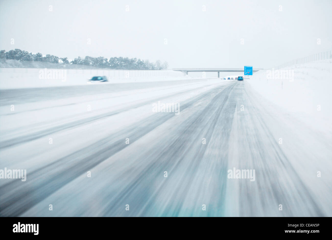 Snow danger on highway Stock Photo - Alamy