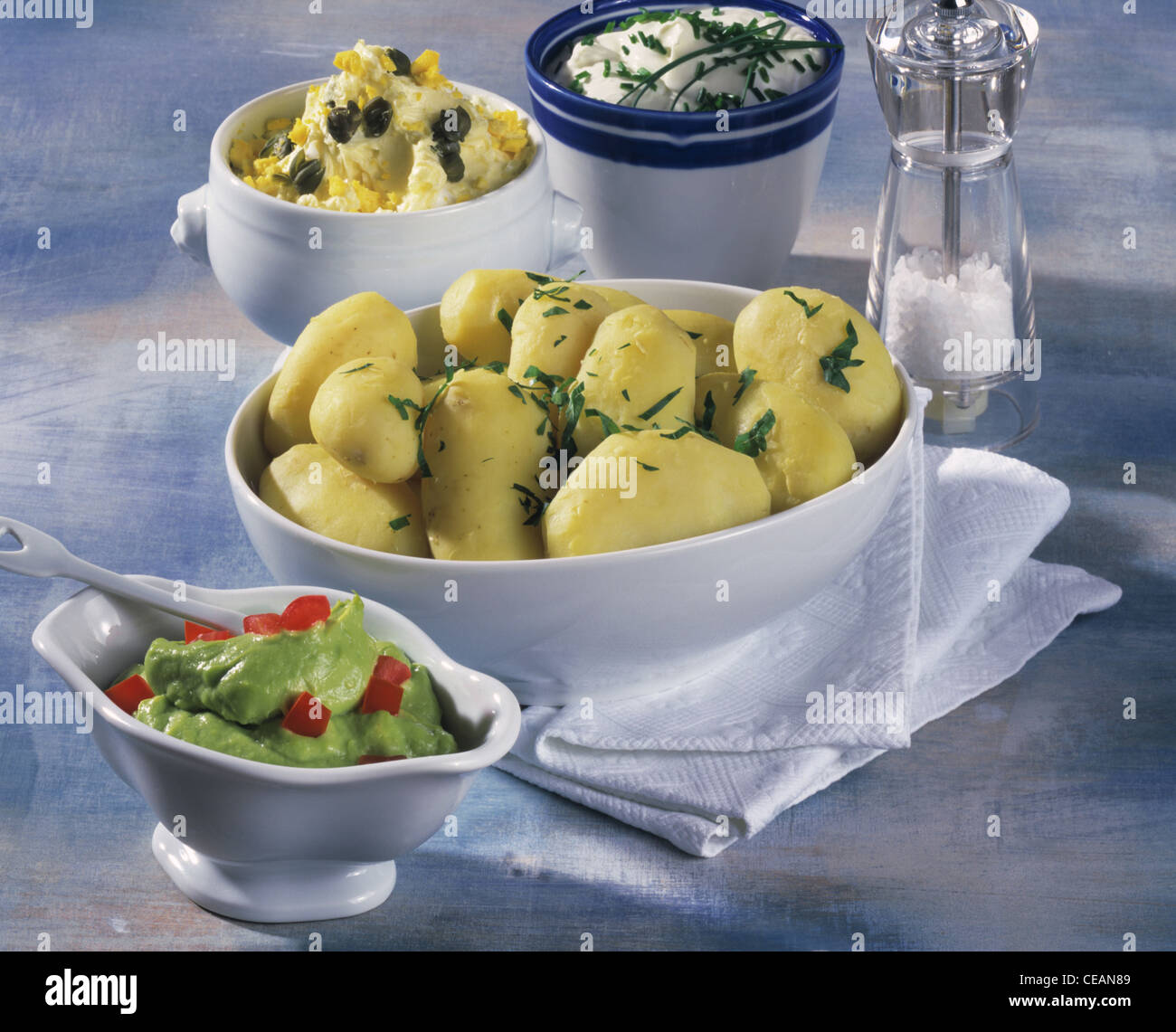 Potato in the skin with three different dips Stock Photo - Alamy