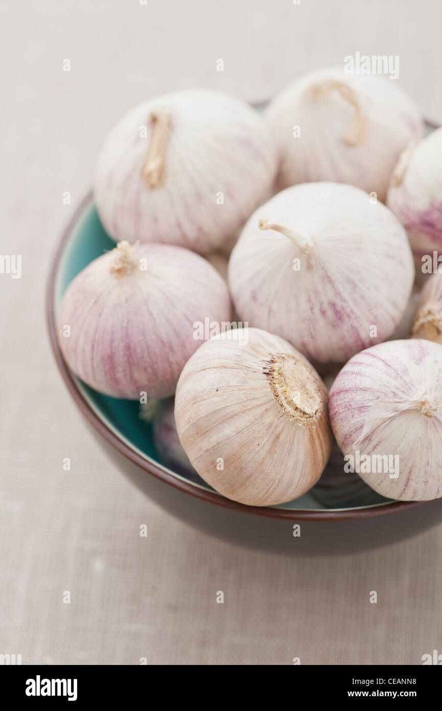 Garlic in a bowl Stock Photo - Alamy