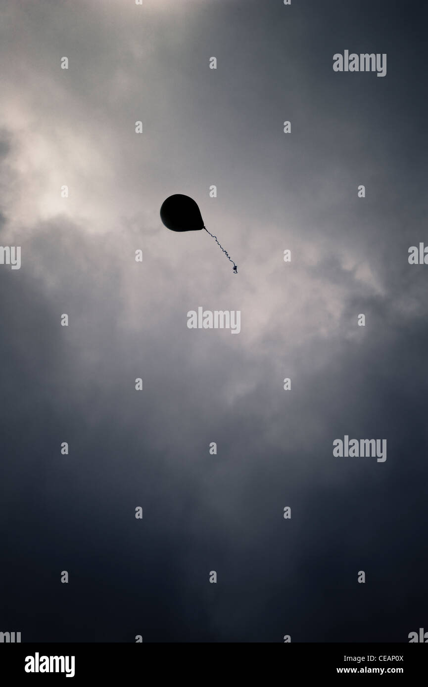 Balloon in Mid-Air against Storm Clouds Stock Photo - Alamy