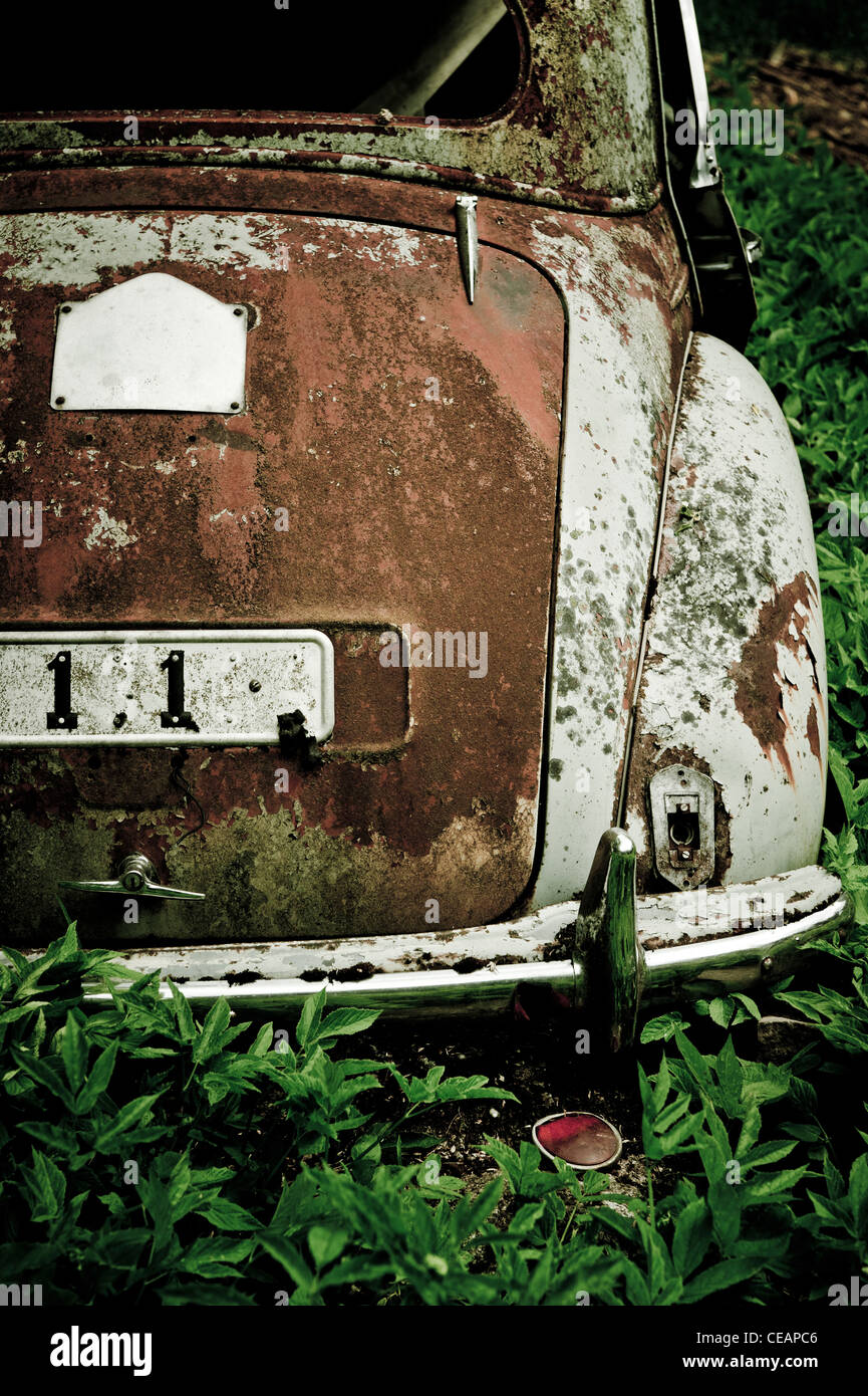 Discarded car in nature Stock Photo - Alamy