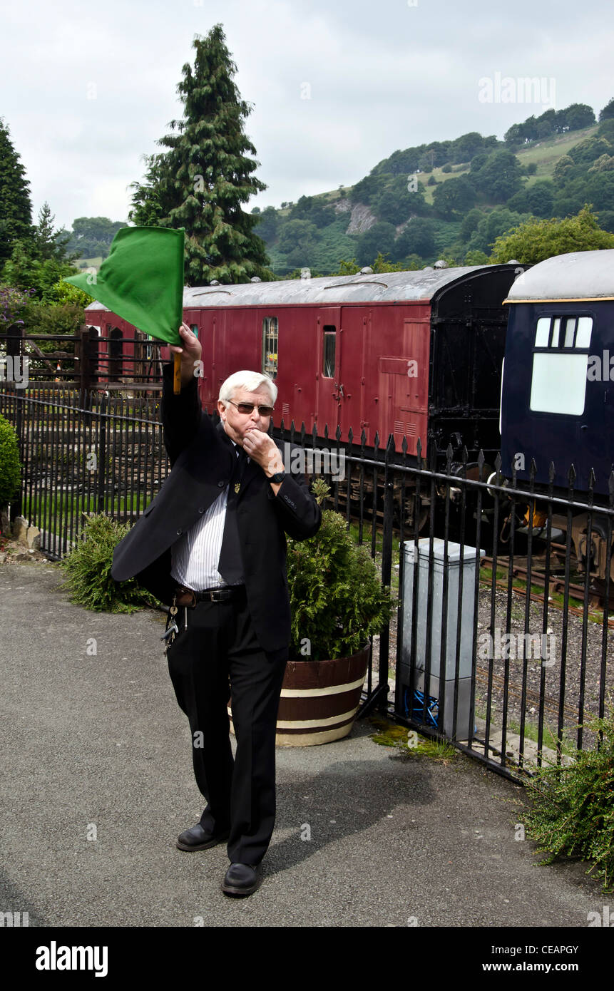 Station Master waving a green flag at Carrog Station on the Llangollen ...