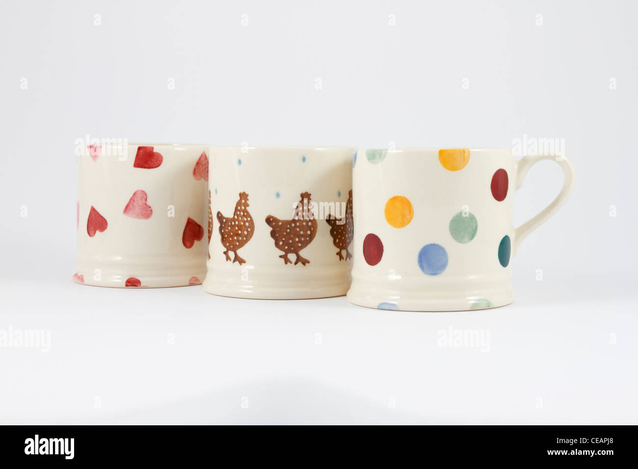 Three Emma Bridgewater mugs on white background Stock Photo - Alamy