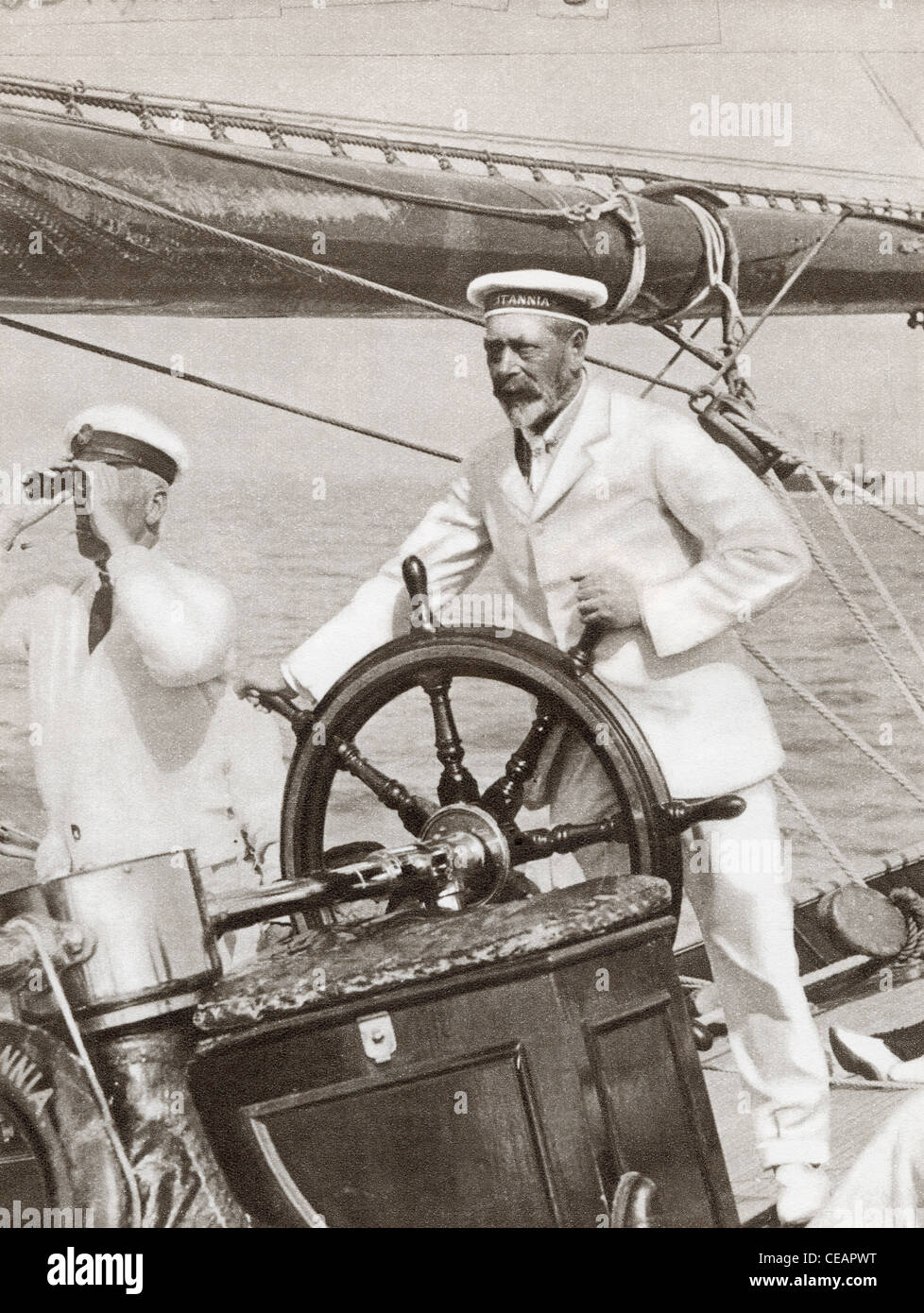 King George V at the wheel of his yacht, Britannia, during Cowes ...