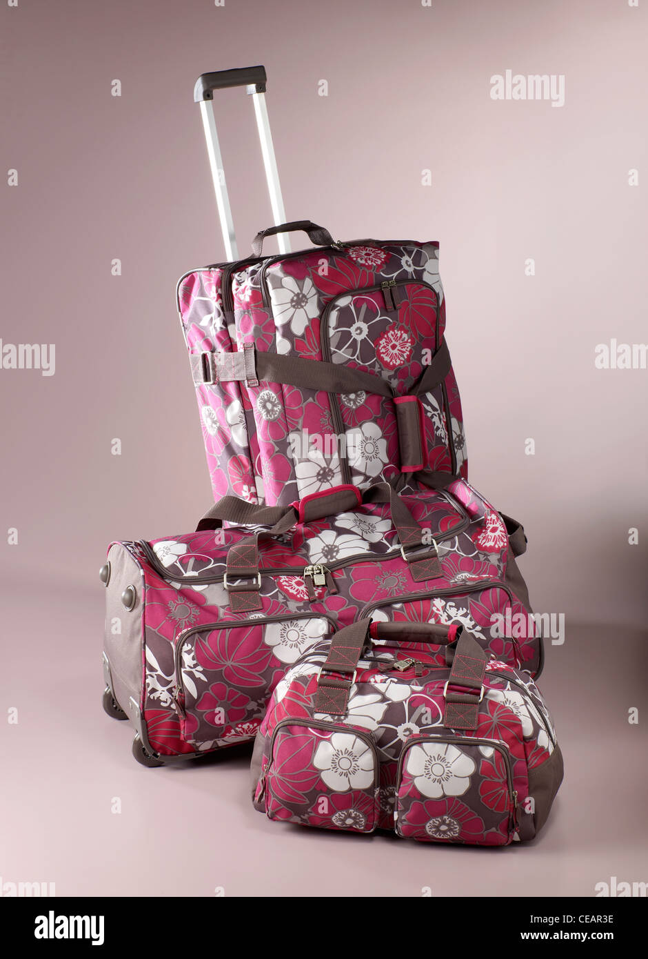 still life shot of a flowery patterned set of luggage Stock Photo - Alamy