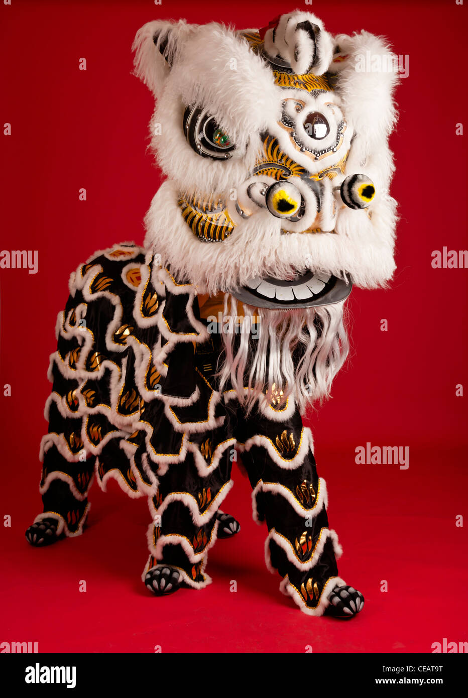 Chinese Dancing Lion on a red background Stock Photo - Alamy