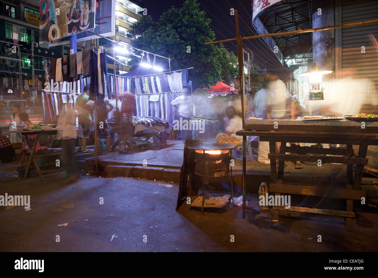 Street food market with watching and talking people. Rangoon, Burma ...