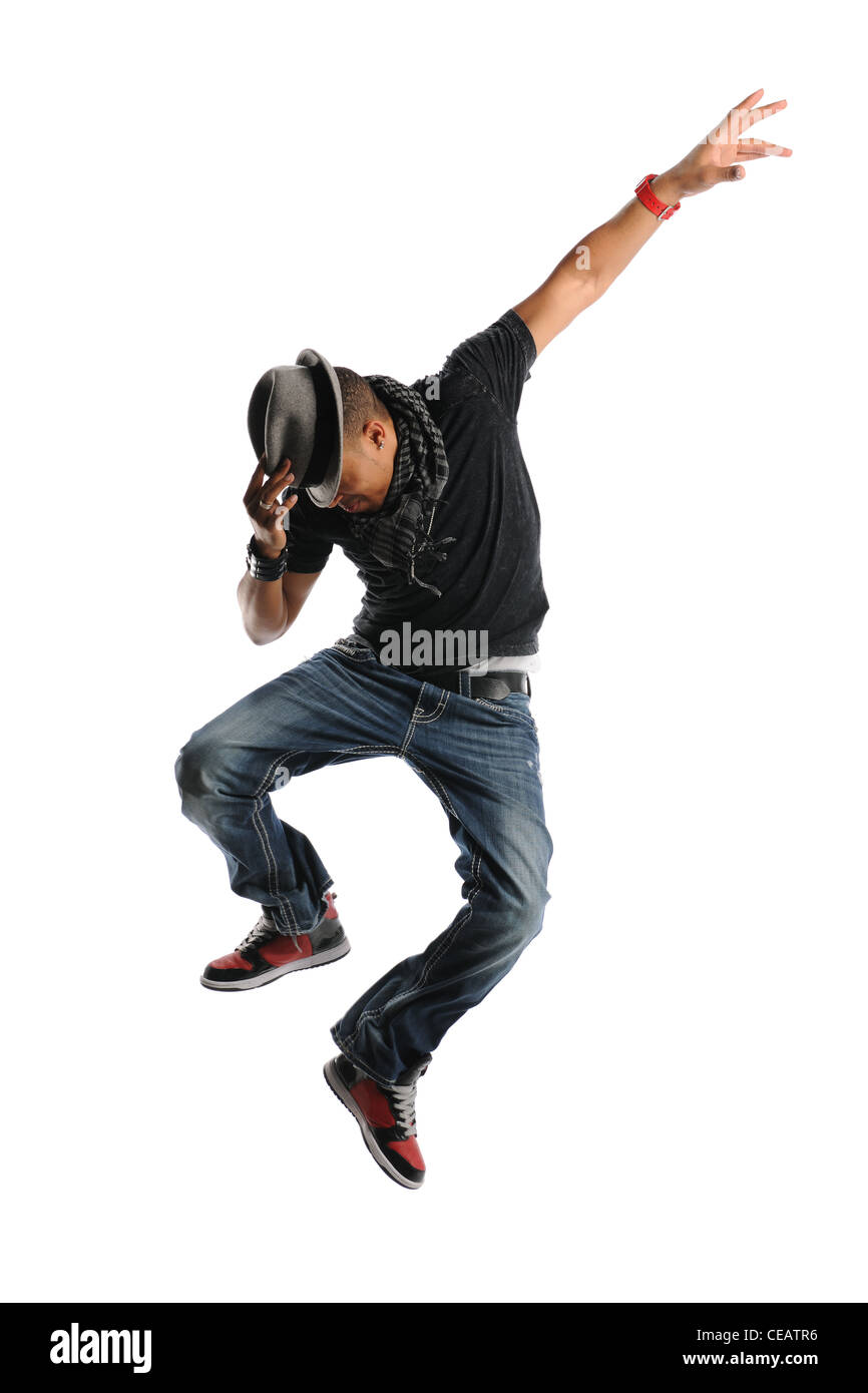 Hip Hop dancer wearing a hat and jumping isolated on a white background ...