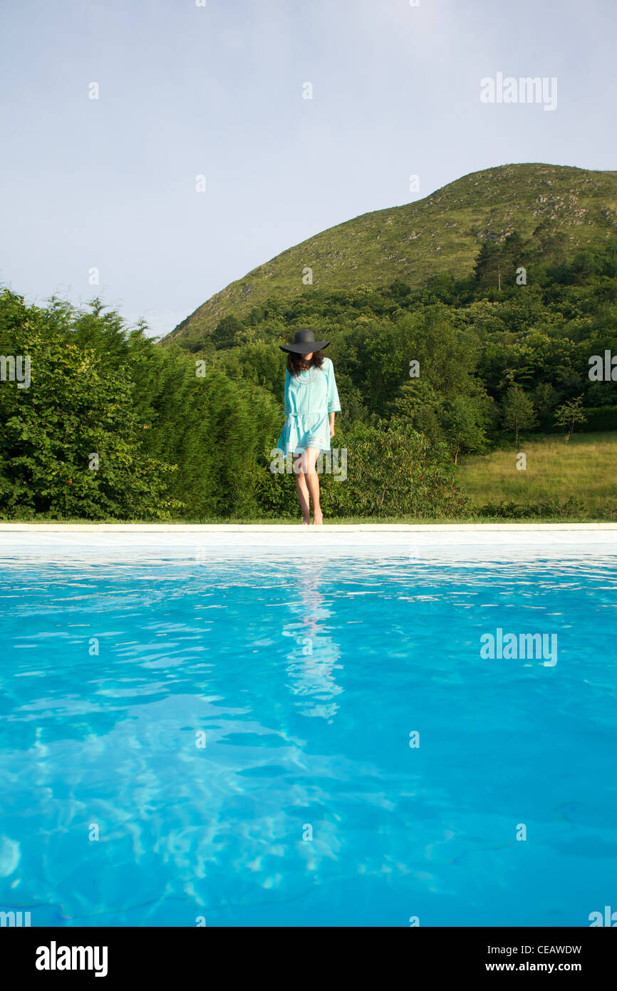 woman barefoot at swimming pool border in Asturias Spain Stock Photo ...
