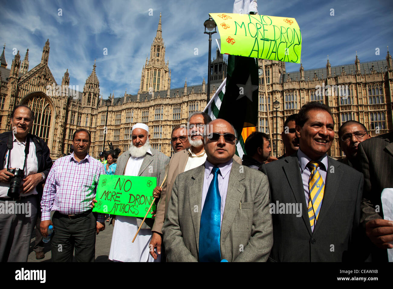 Pakistanis demonstrate outside the Houses of Parliament in London ...