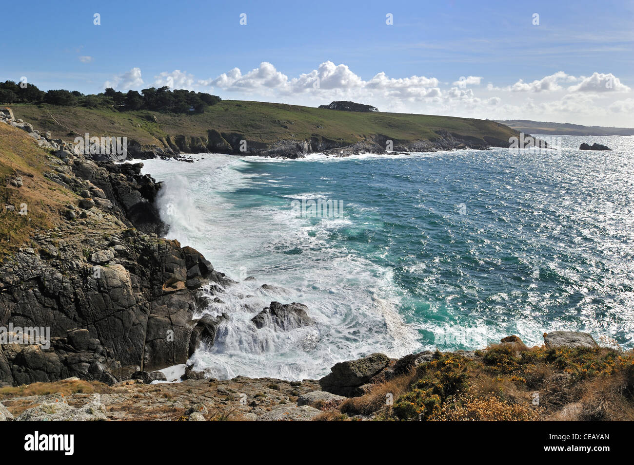 Waves crashing on the rocks of sea cliff at the Pointe du Millier at ...