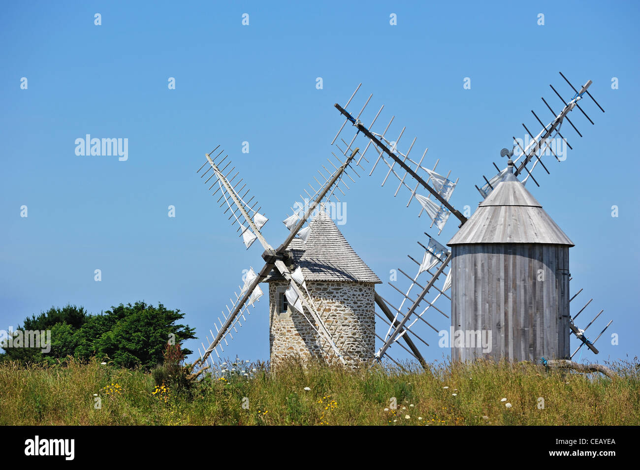 Two traditional windmills at the Pointe du Van, Finistère, Brittany ...