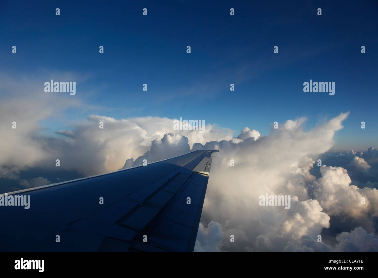 clouds seen from the window of a passenger Jet airplane airliner ...