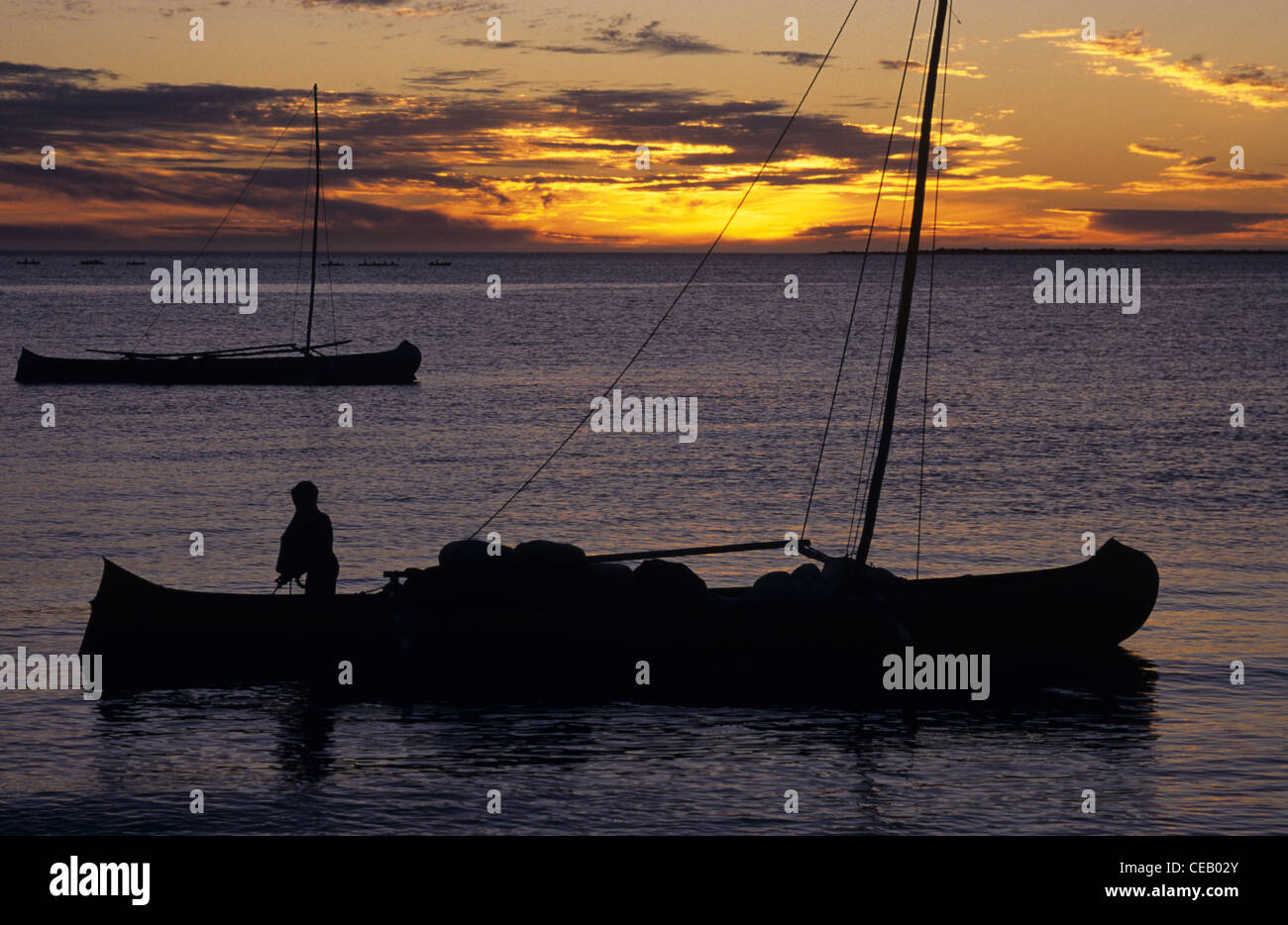 Vezo Pirogues or Outrigger Canoes Silhouetted at Sunset or Dusk, Anakao ...