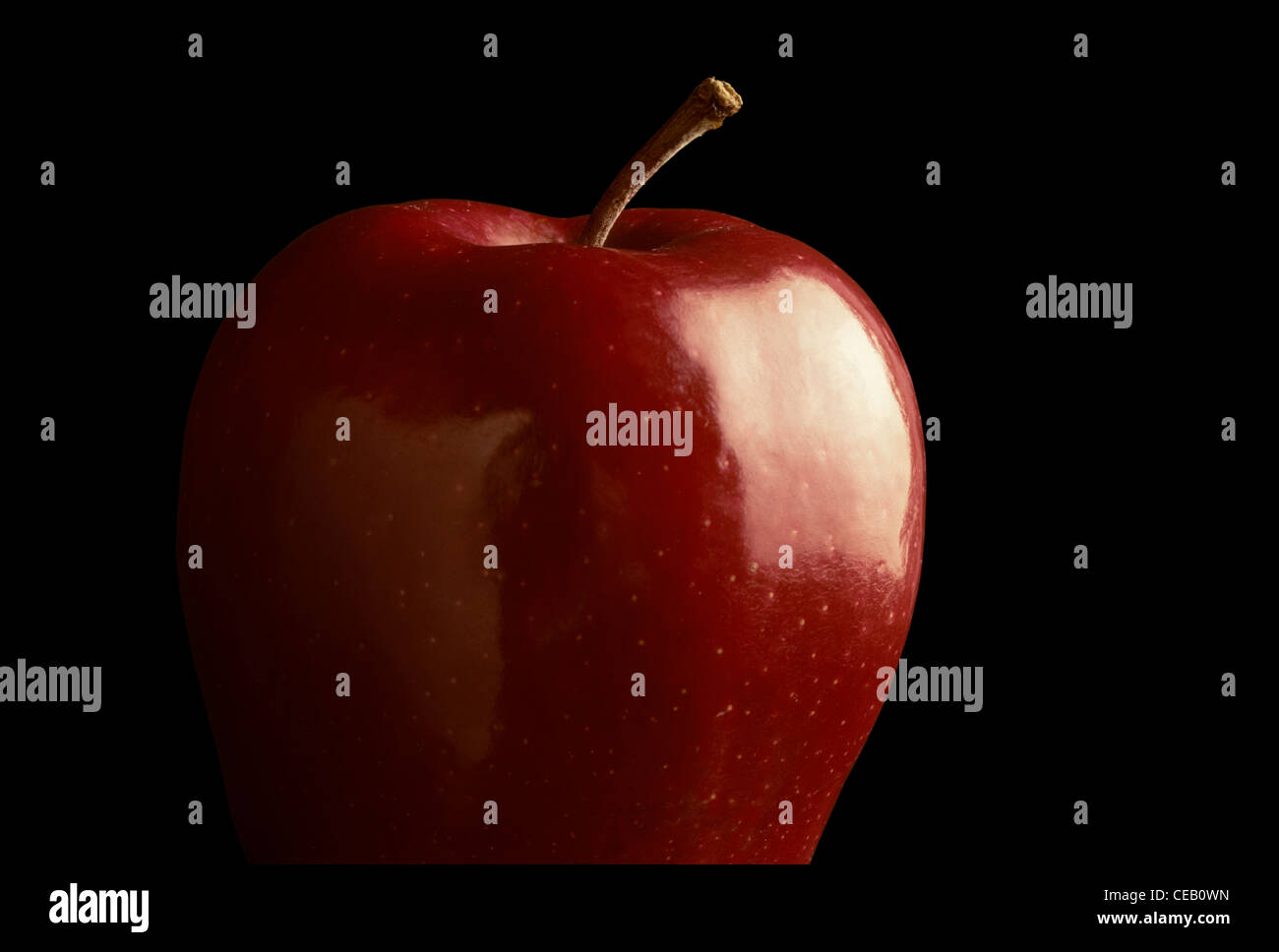 Single red Delicious apple against black background Stock Photo - Alamy