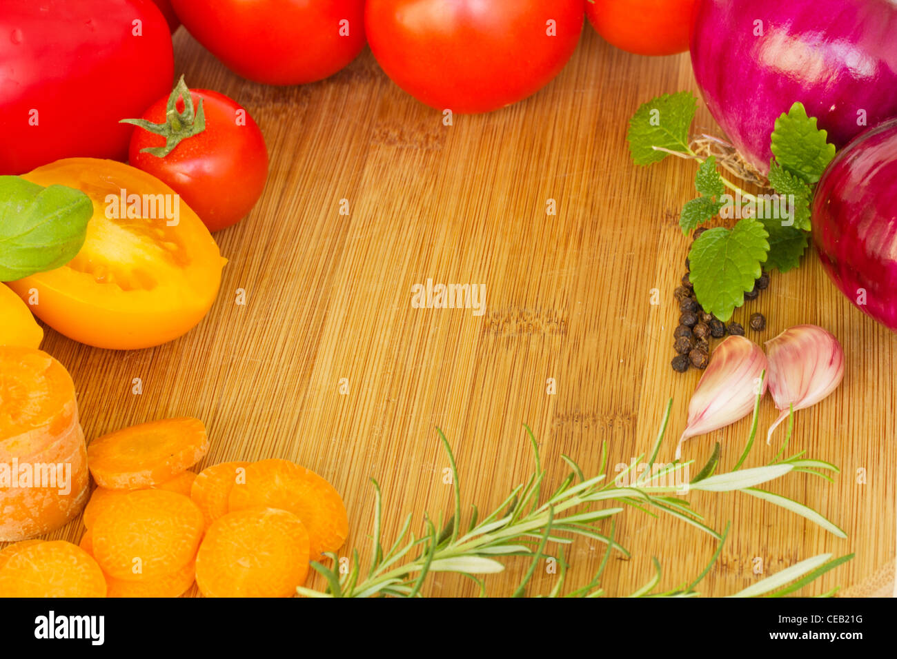 wooden desk and frame of colorful vegetables Stock Photo - Alamy