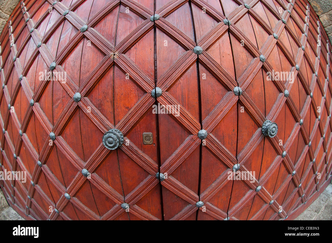 Main entrance and wooden door of the church of Isona, Lleida, Spain ...