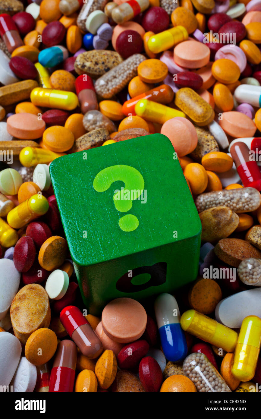 Question mark and pills Stock Photo - Alamy