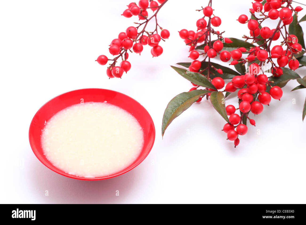 Japanese sweet mild sake and nandina domestica Stock Photo - Alamy
