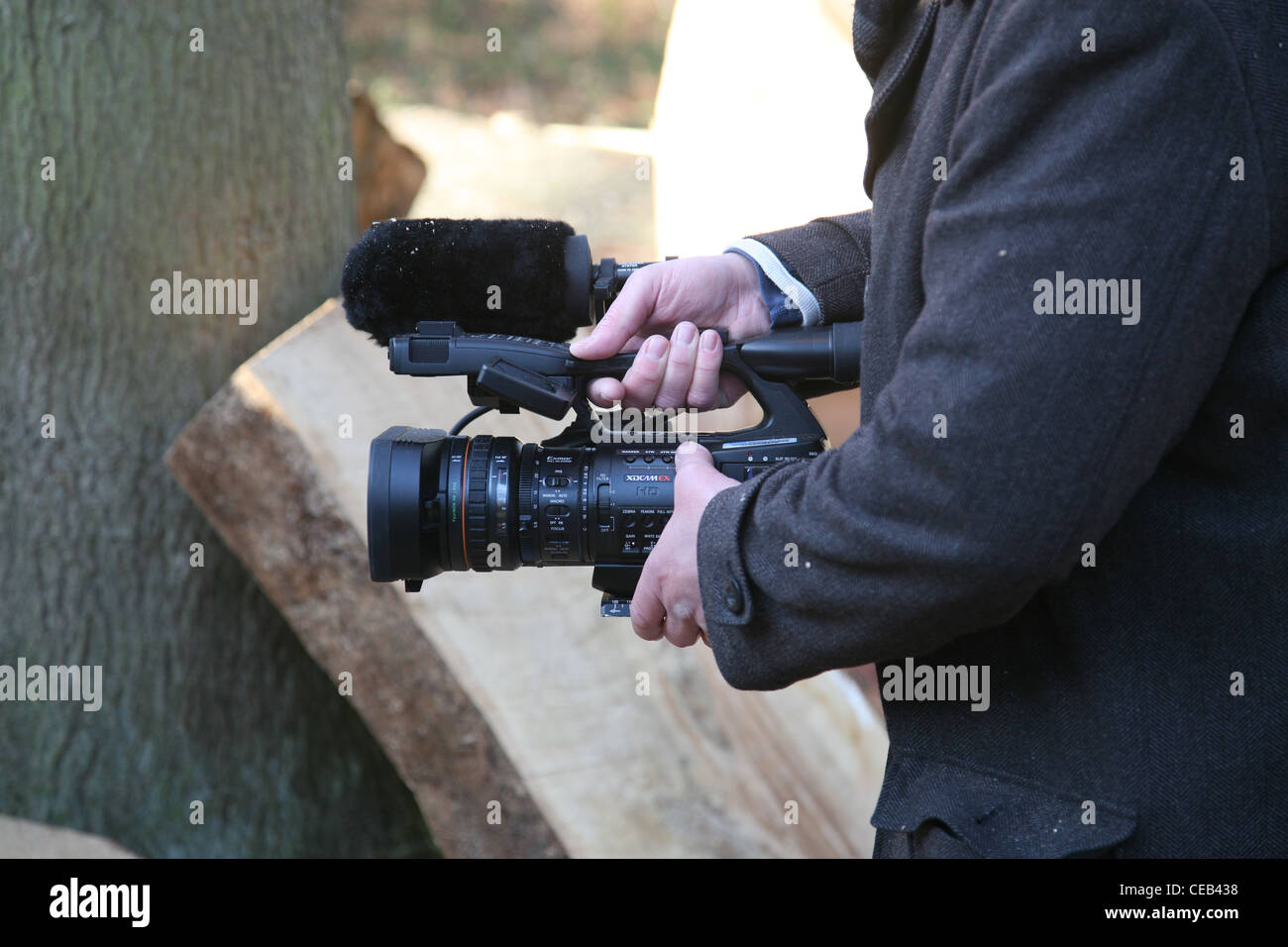 a videographer filming Stock Photo - Alamy