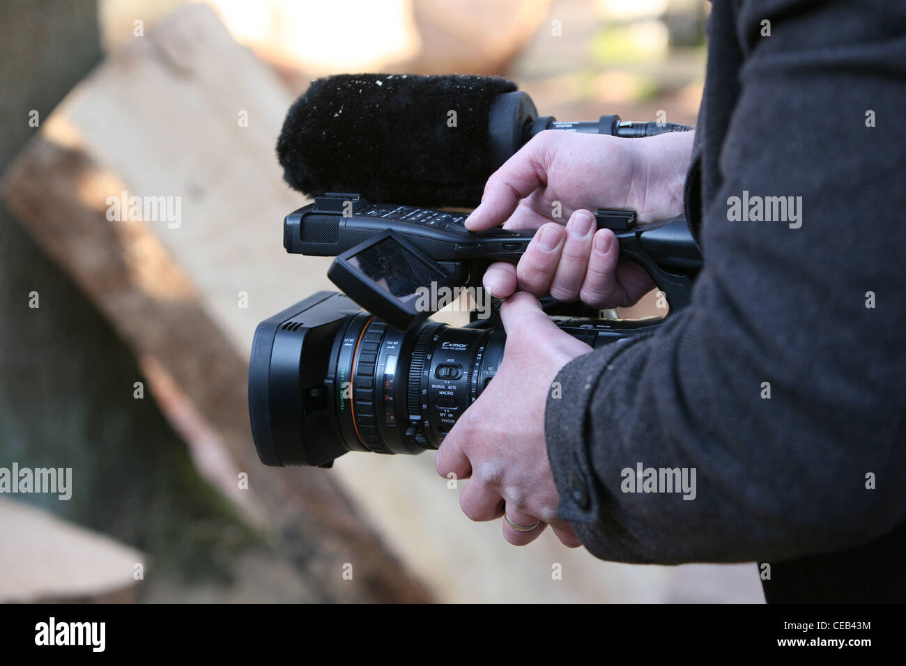a videographer filming Stock Photo - Alamy