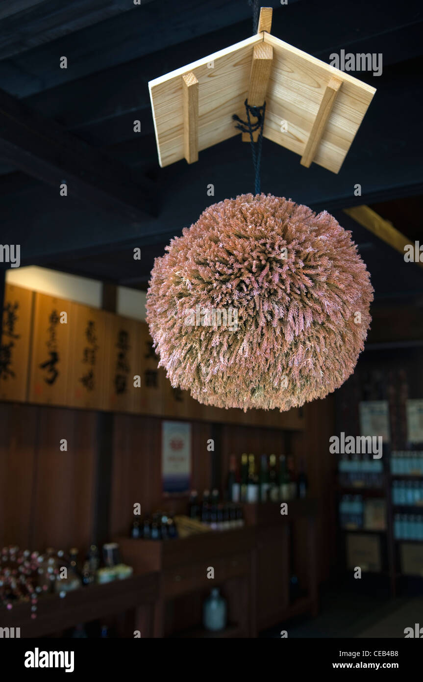 A traditional cedar ball hanging in front of a sake brewery Takayama ...
