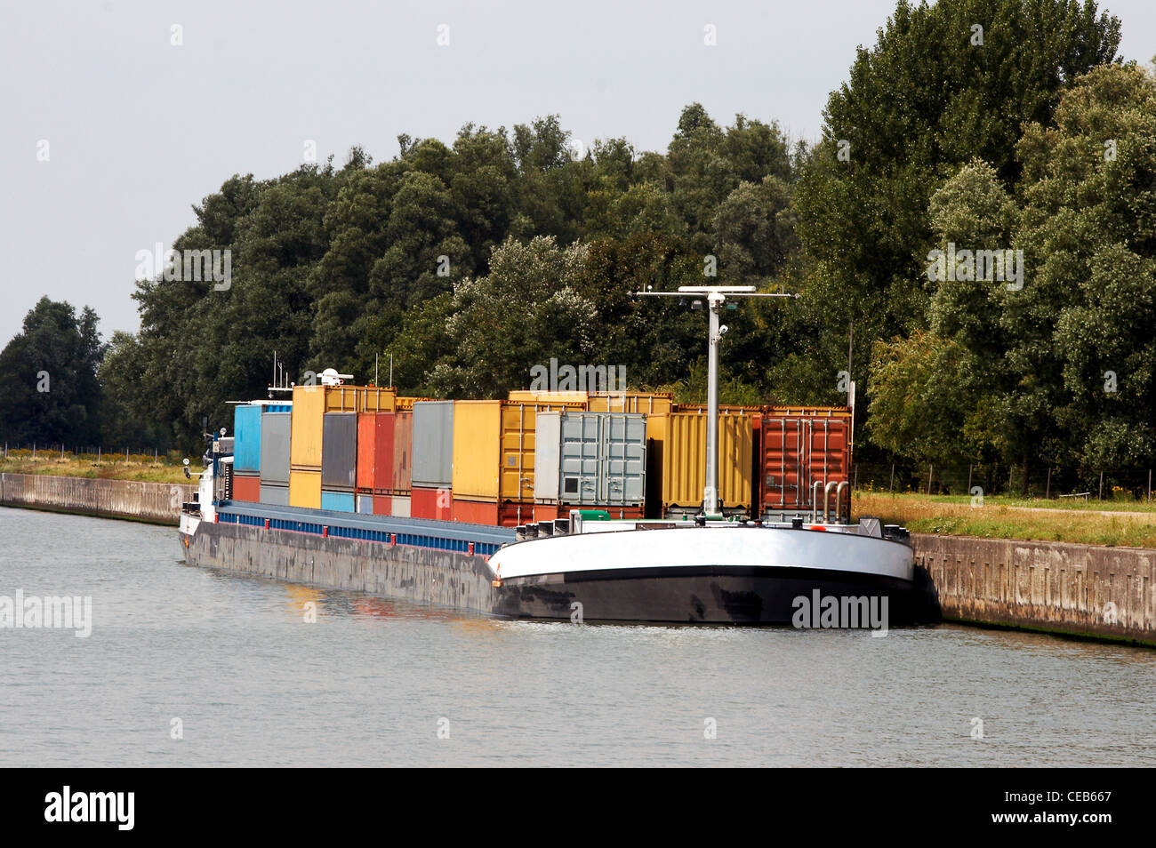 Containers in a barge near Antwerp harbor Stock Photo - Alamy