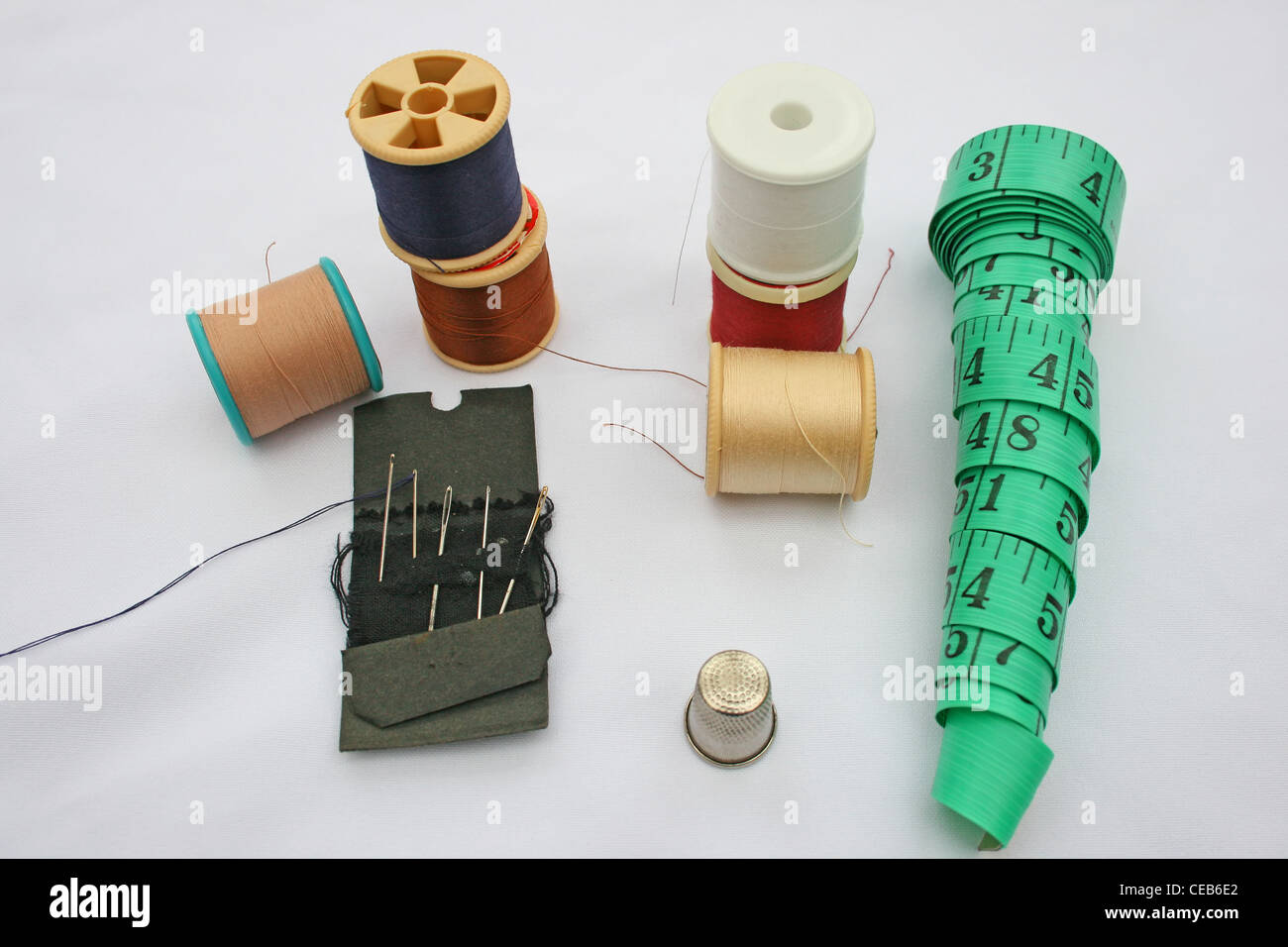 basic sewing kit including a thimble and a tape measure Stock Photo - Alamy