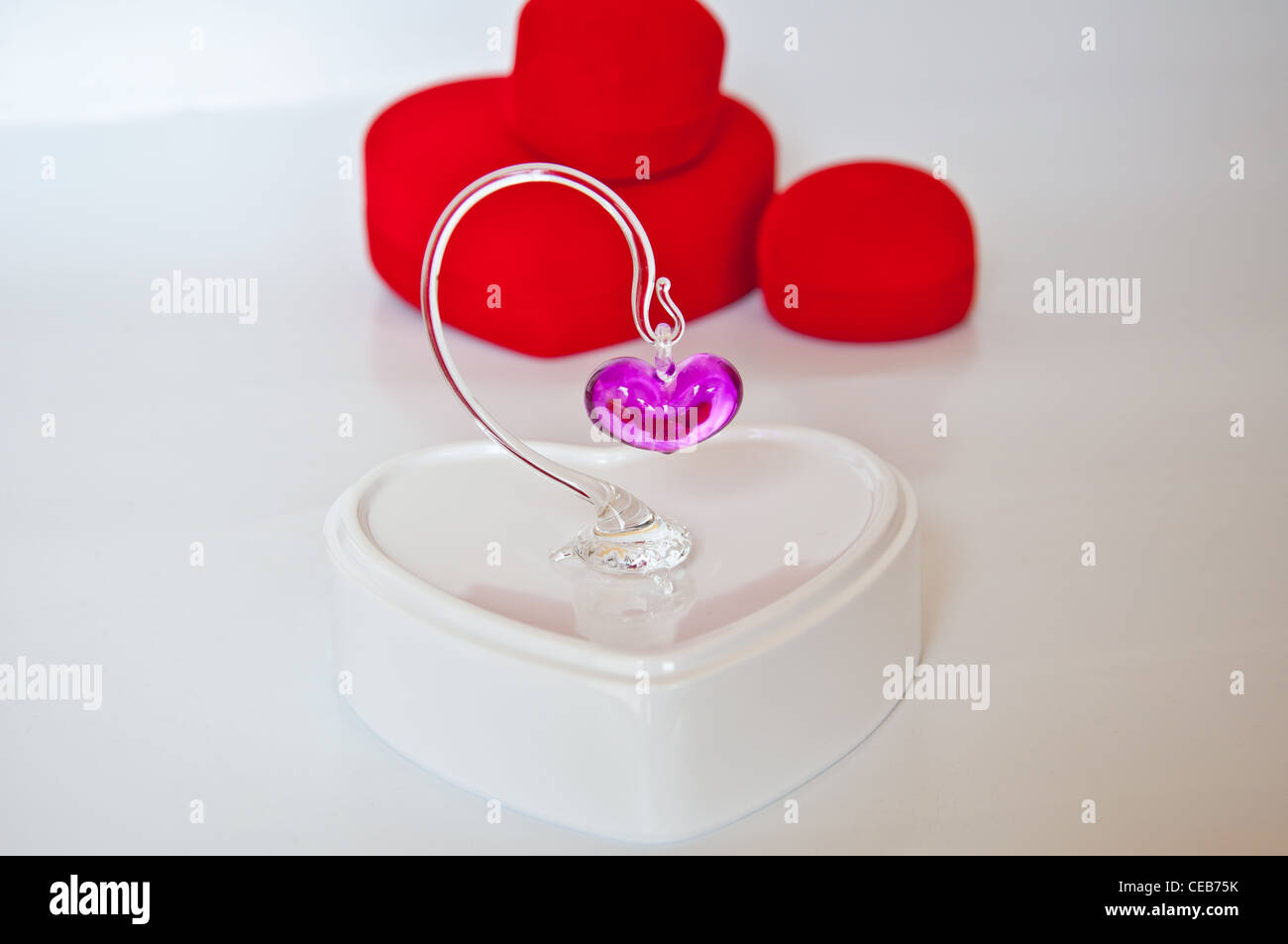 violet heart shape on white background Stock Photo - Alamy