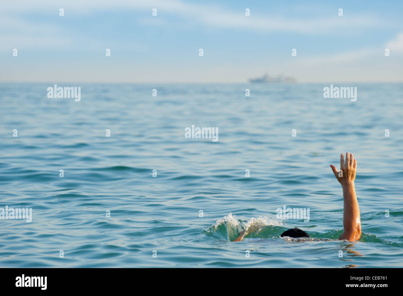 The drowning man. The man in water asks about the help Stock Photo - Alamy