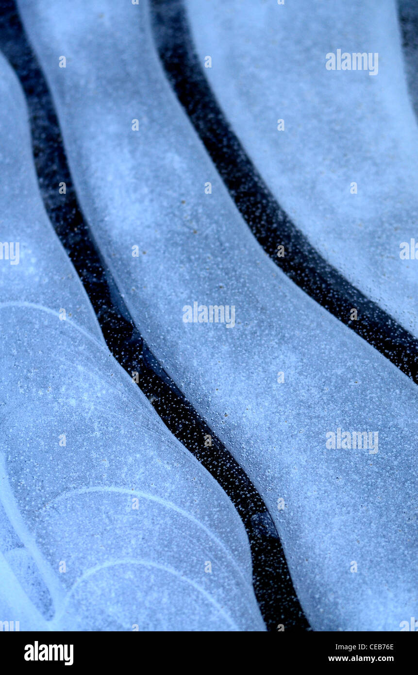 Patterns in frozen water on lake Stock Photo - Alamy