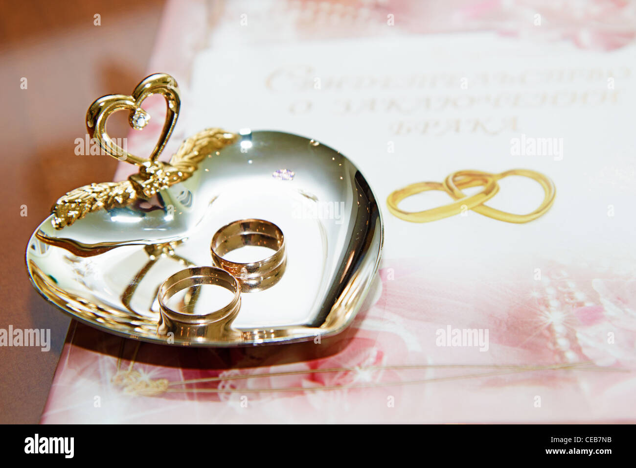 wedding rings and marriage certificate to the registration desk Stock ...