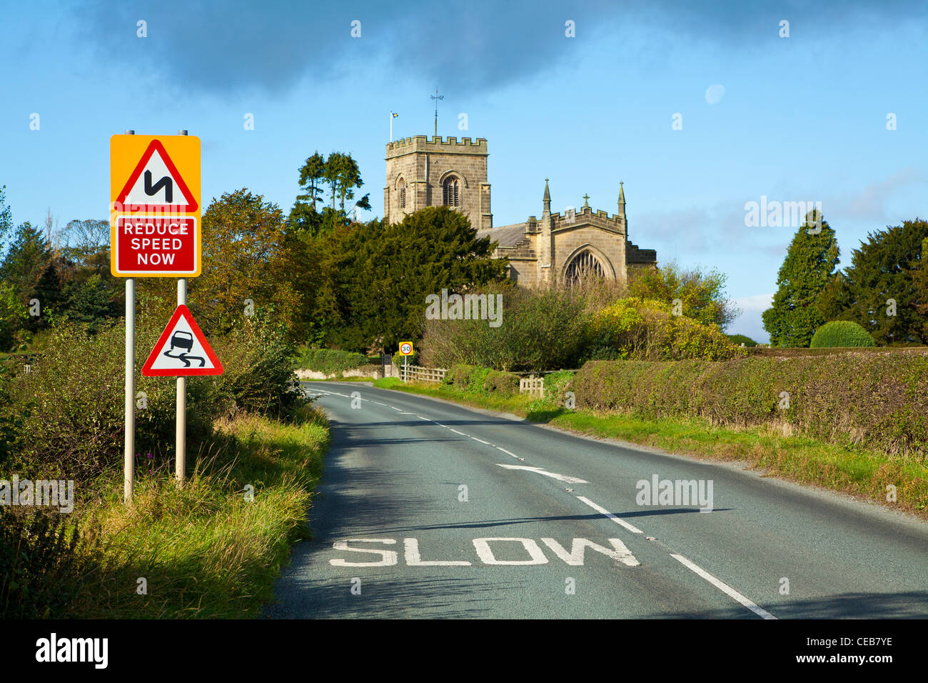 Road signs in front of St John the Evangelist church, East Witton ...