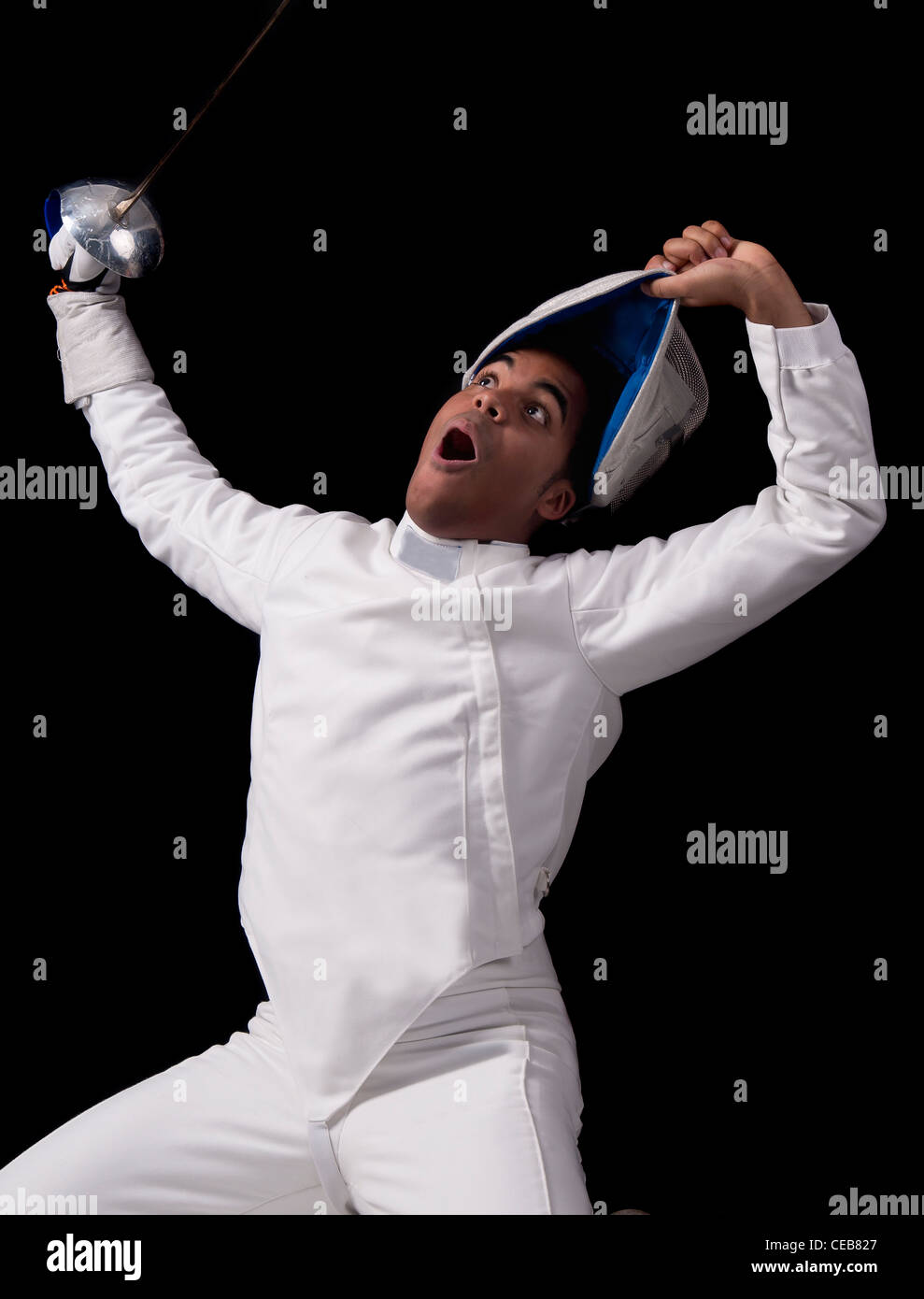 Male fencer isolated in a dark background Stock Photo - Alamy