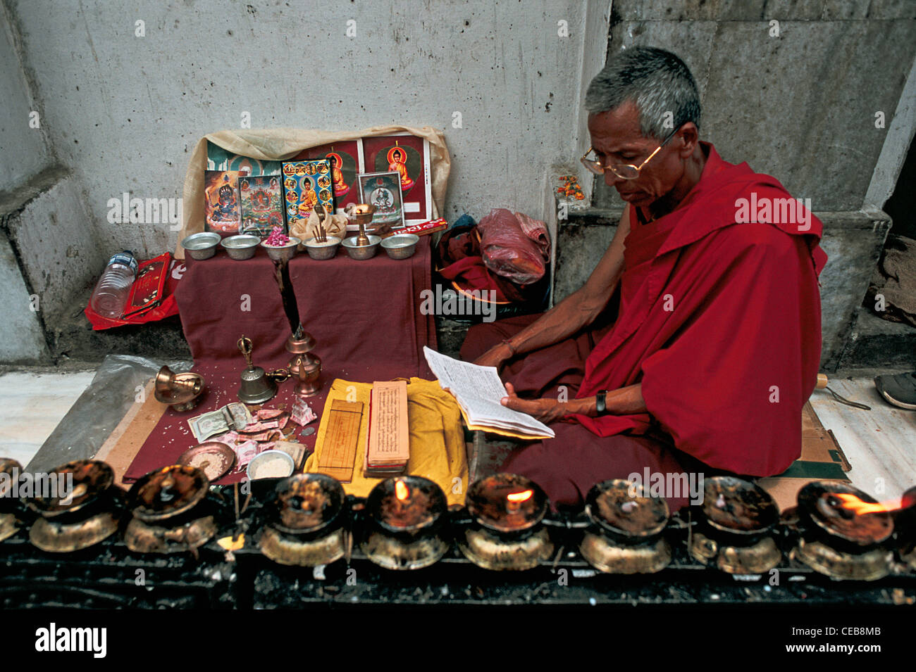 Buddhist monk reading a holy text in a hindu temple ( Nepal Stock Photo ...