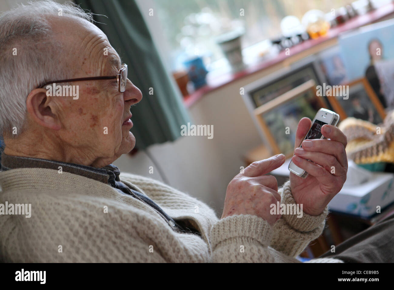 elderly older man adopting using enjoying new technology, iPhone 4S ...