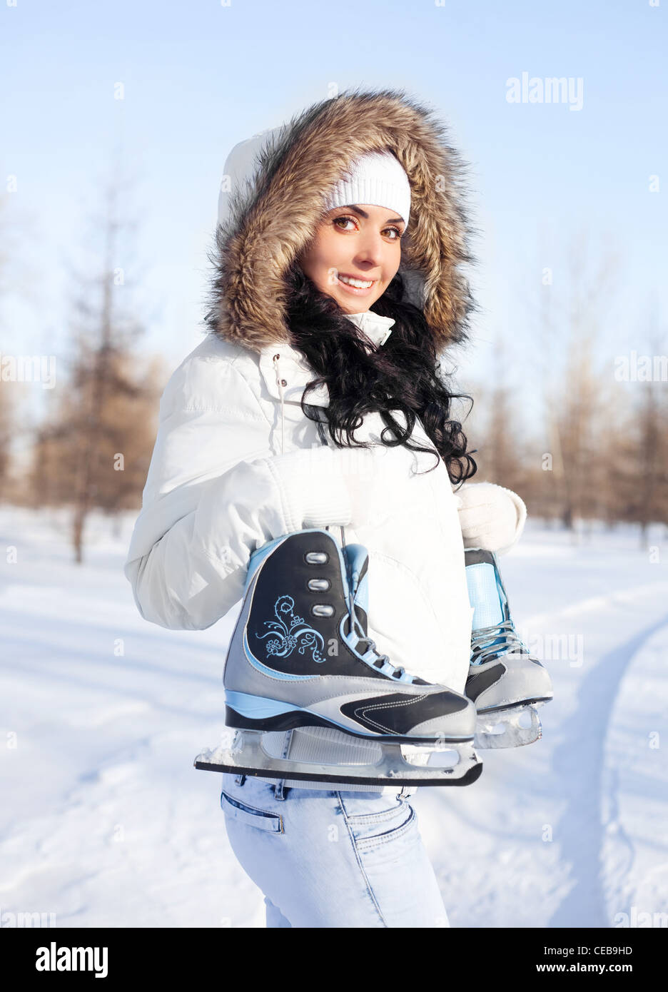 happy woman going ice skating on a winter day Stock Photo - Alamy