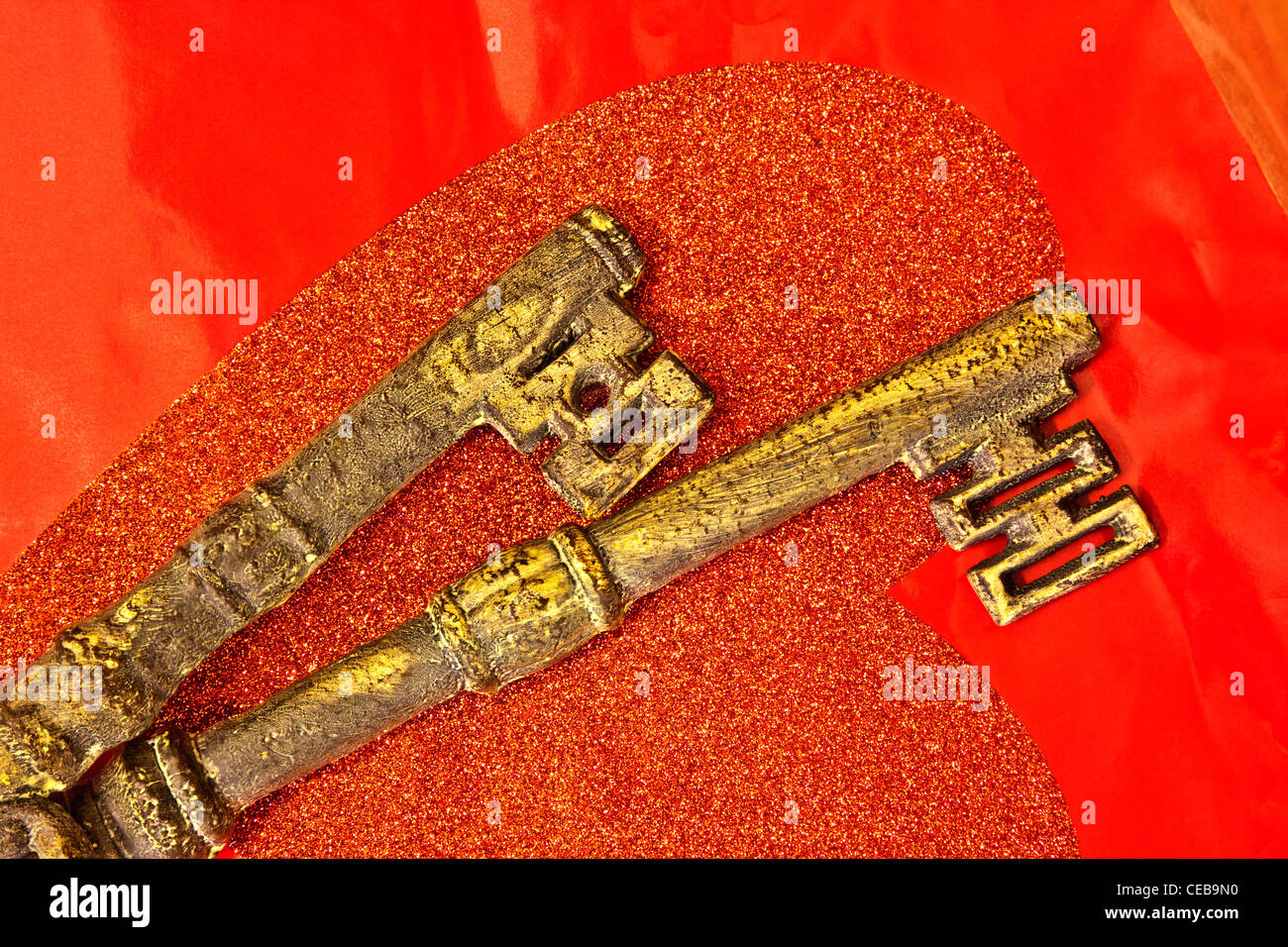 Ornate brass keys, red heart Stock Photo - Alamy