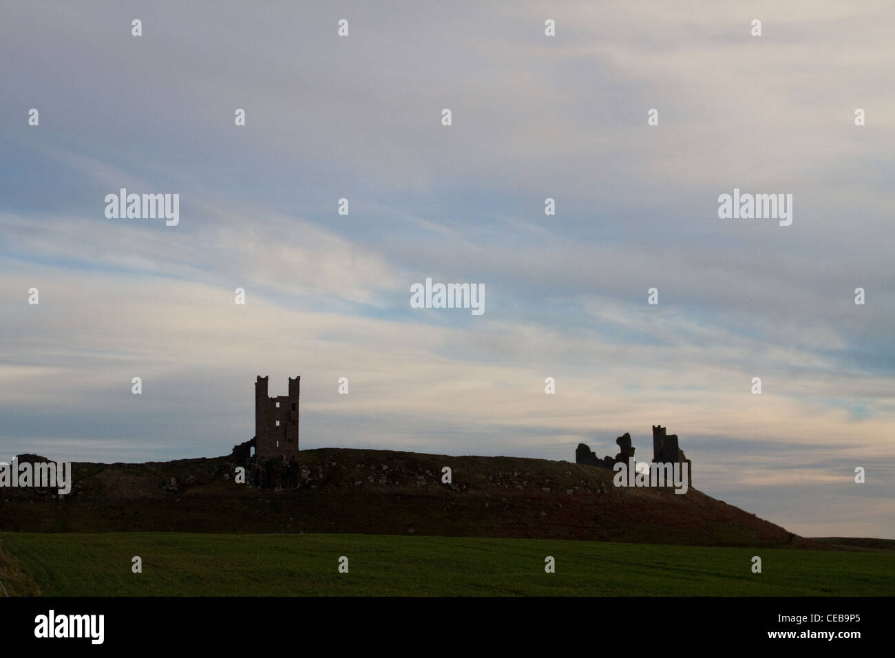 Dunstanburgh at sunset hi-res stock photography and images - Alamy